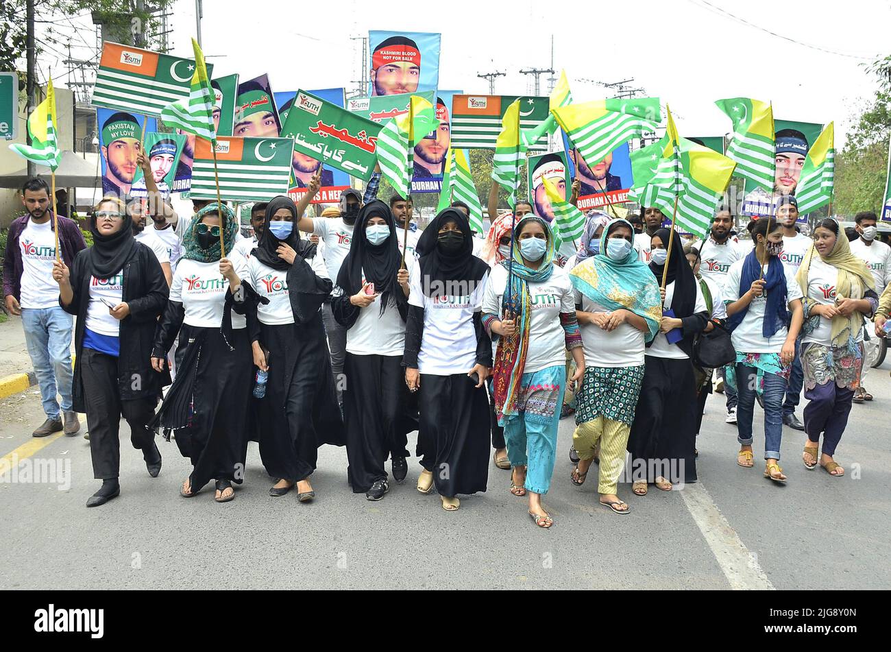 Pakistani activists of Youth Forum for Kashmir hold placards featuring ...