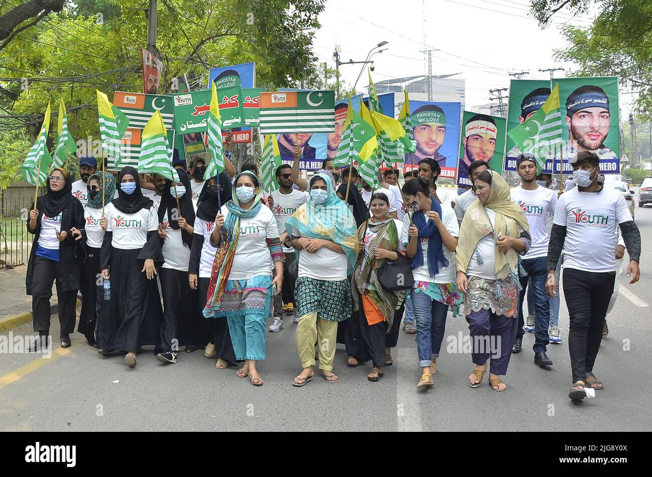 Pakistani activists of Youth Forum for Kashmir hold placards featuring ...