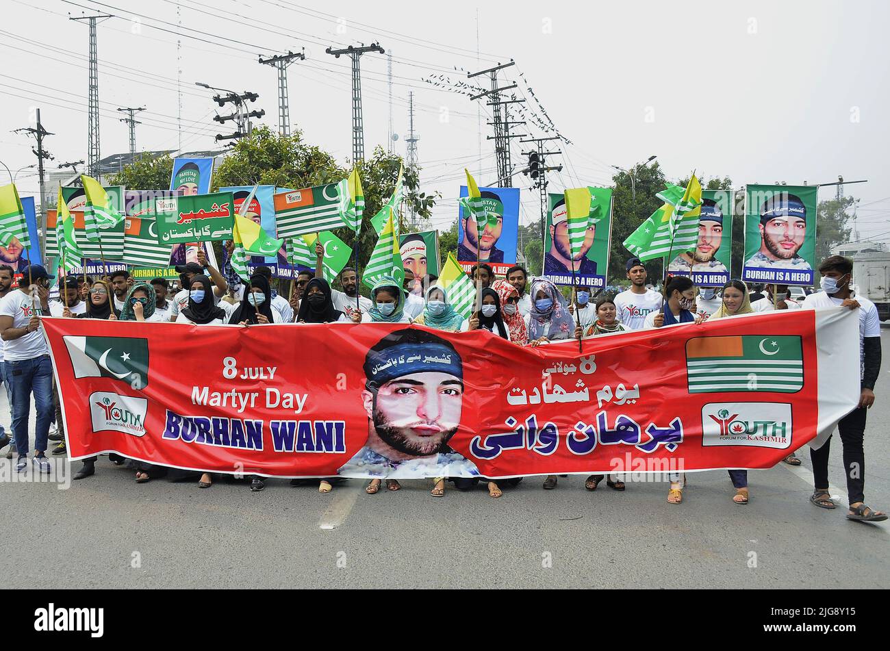 Pakistani activists of Youth Forum for Kashmir hold placards featuring ...