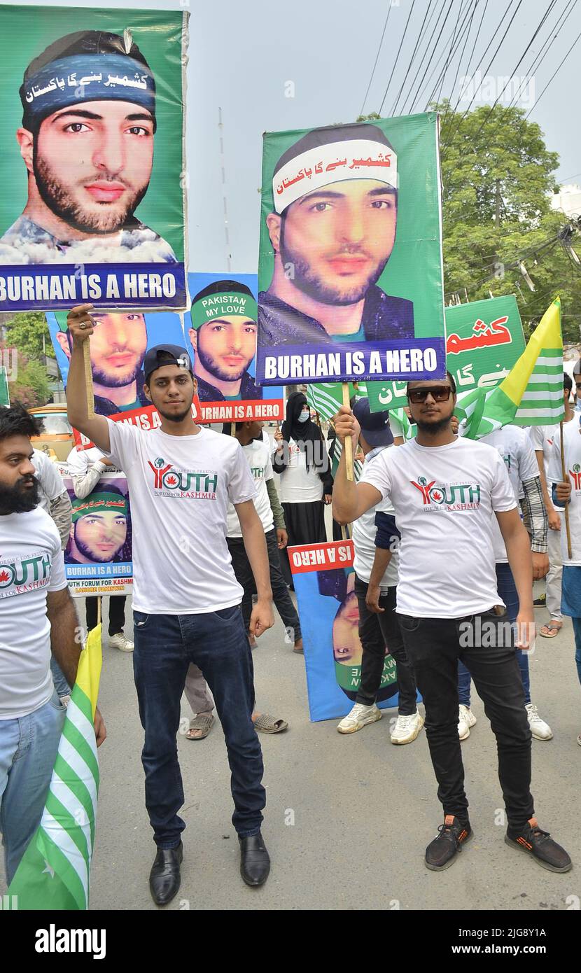 Pakistani activists of Youth Forum for Kashmir hold placards featuring ...