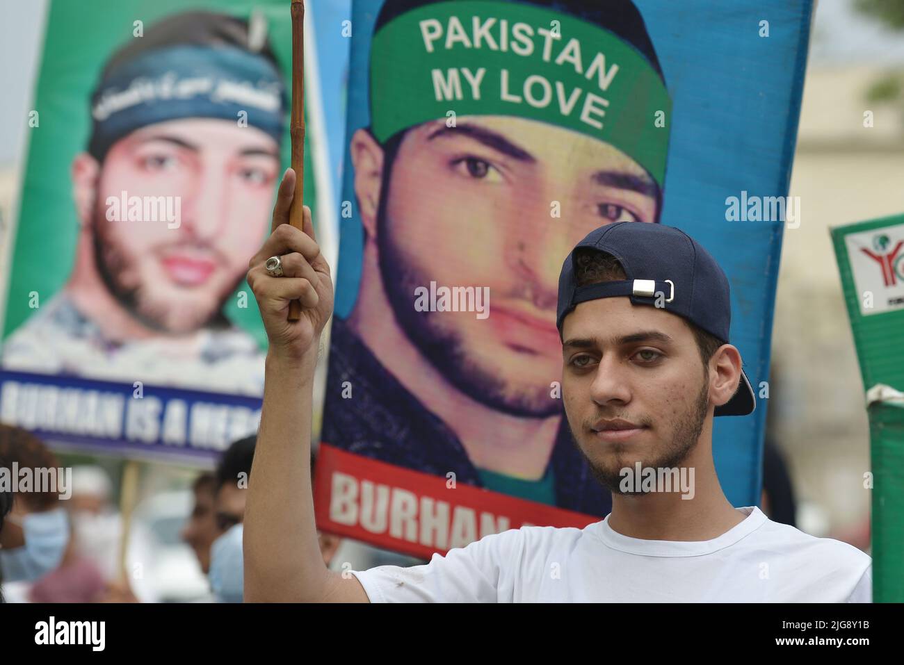 Pakistani activists of Youth Forum for Kashmir hold placards featuring ...