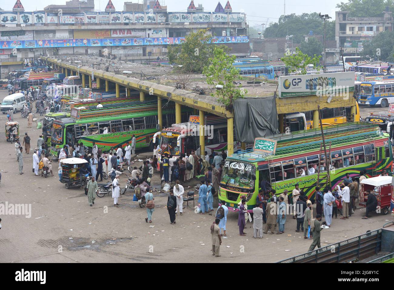 Pakistani people boarding roof top on a crowded bus as they travel to ...