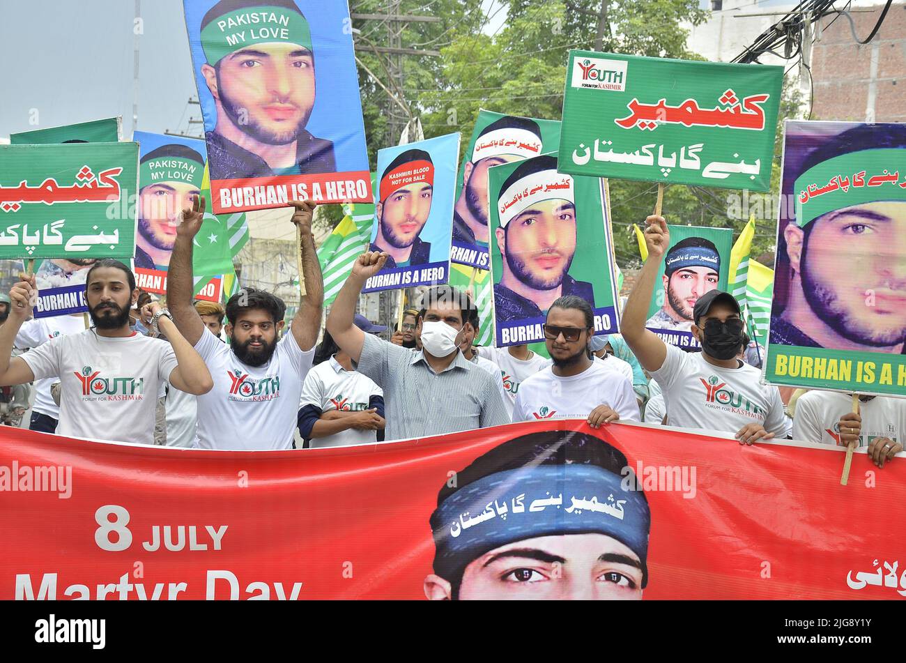 Pakistani activists of Youth Forum for Kashmir hold placards featuring ...