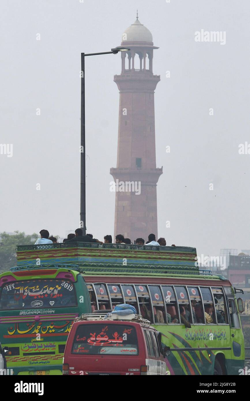 Pakistani people boarding roof top on a crowded bus as they travel to ...
