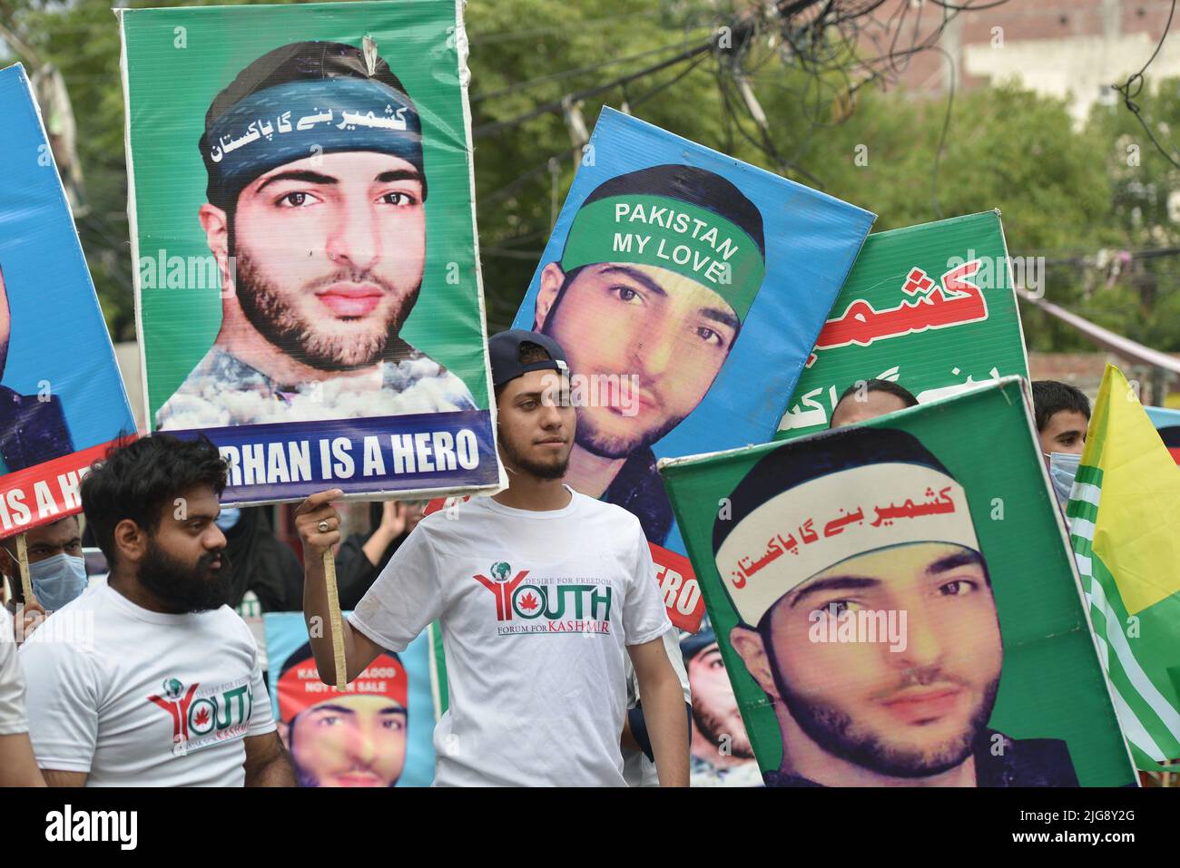 Pakistani activists of Youth Forum for Kashmir hold placards featuring ...
