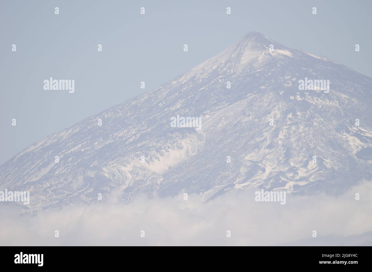 Mount Teide partially covered with snow. Teide National Park. Tenerife ...