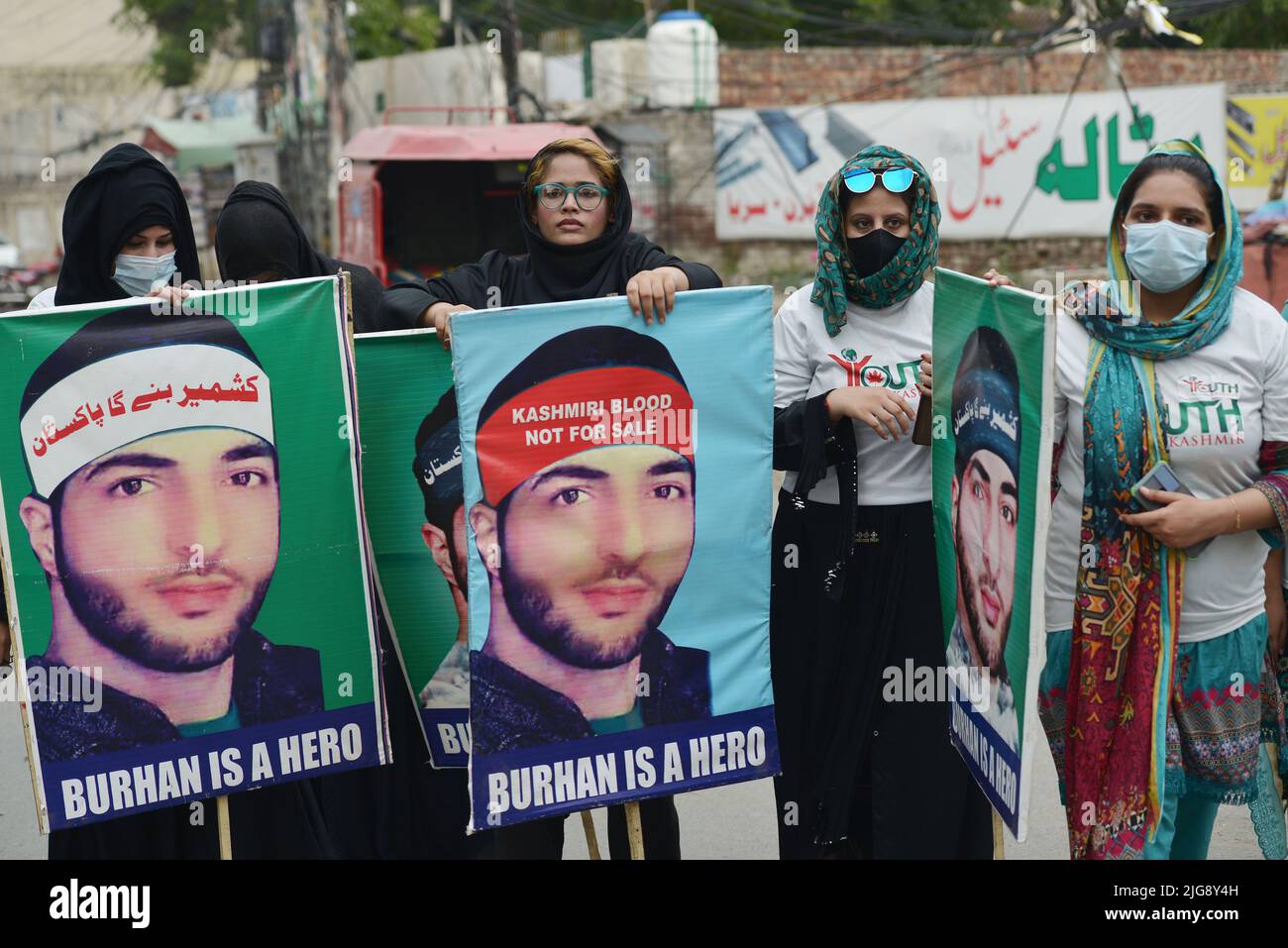 Pakistani activists of Youth Forum for Kashmir hold placards featuring ...