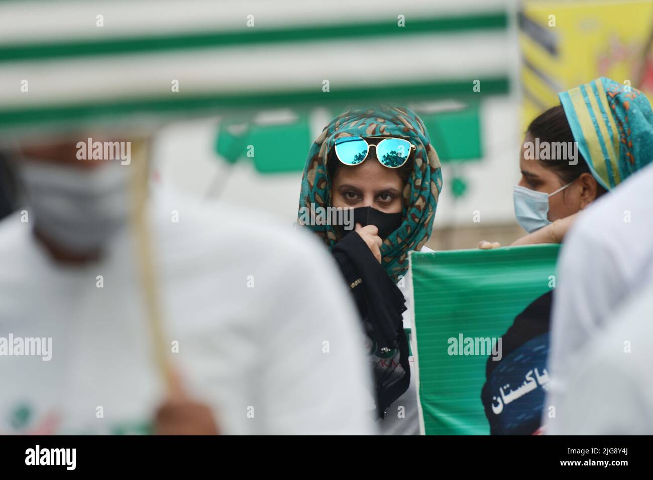 Pakistani activists of Youth Forum for Kashmir hold placards featuring ...