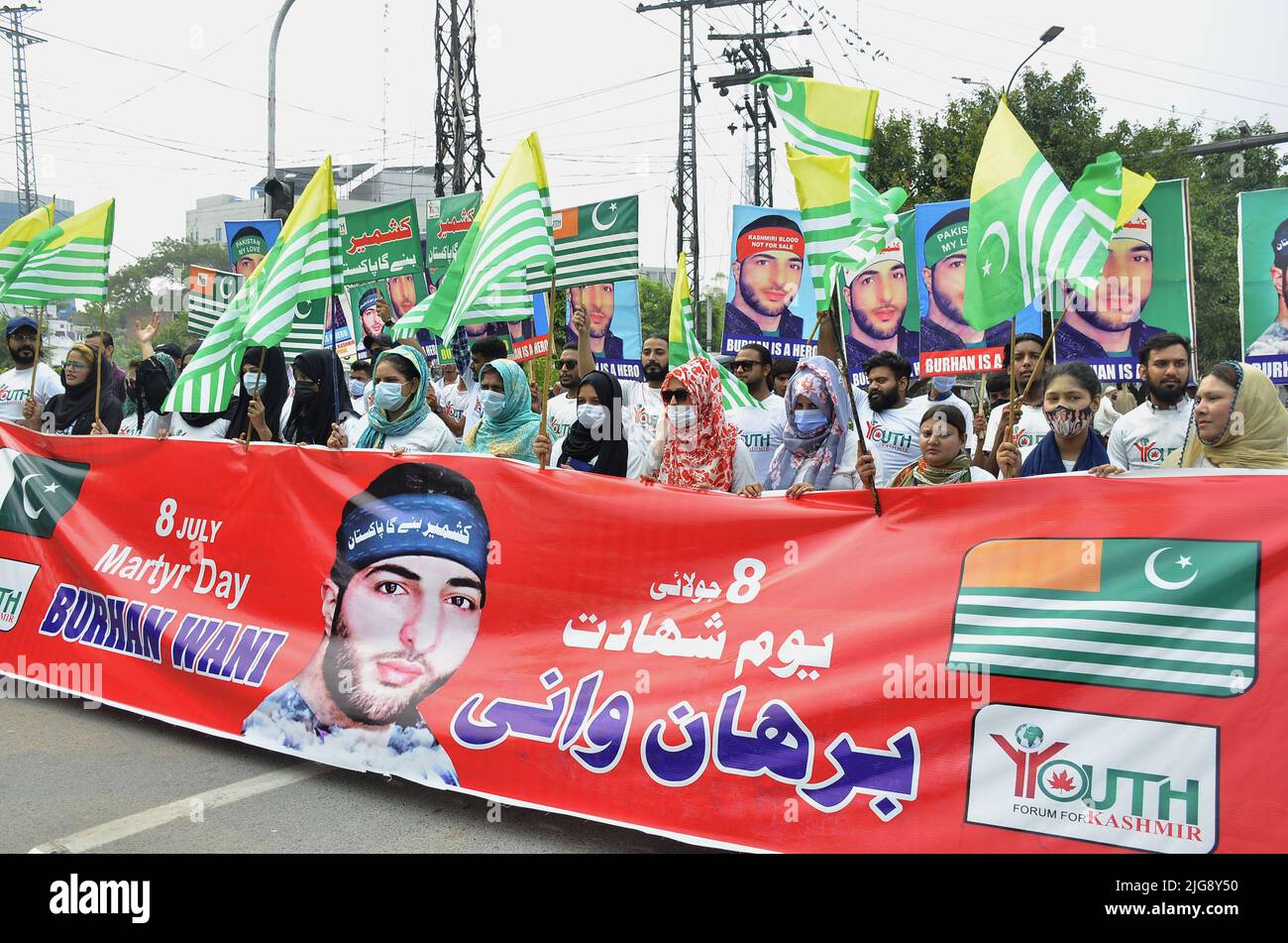 Pakistani activists of Youth Forum for Kashmir hold placards featuring ...
