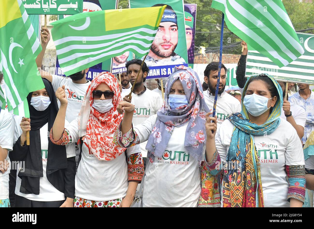 Pakistani activists of Youth Forum for Kashmir hold placards featuring ...