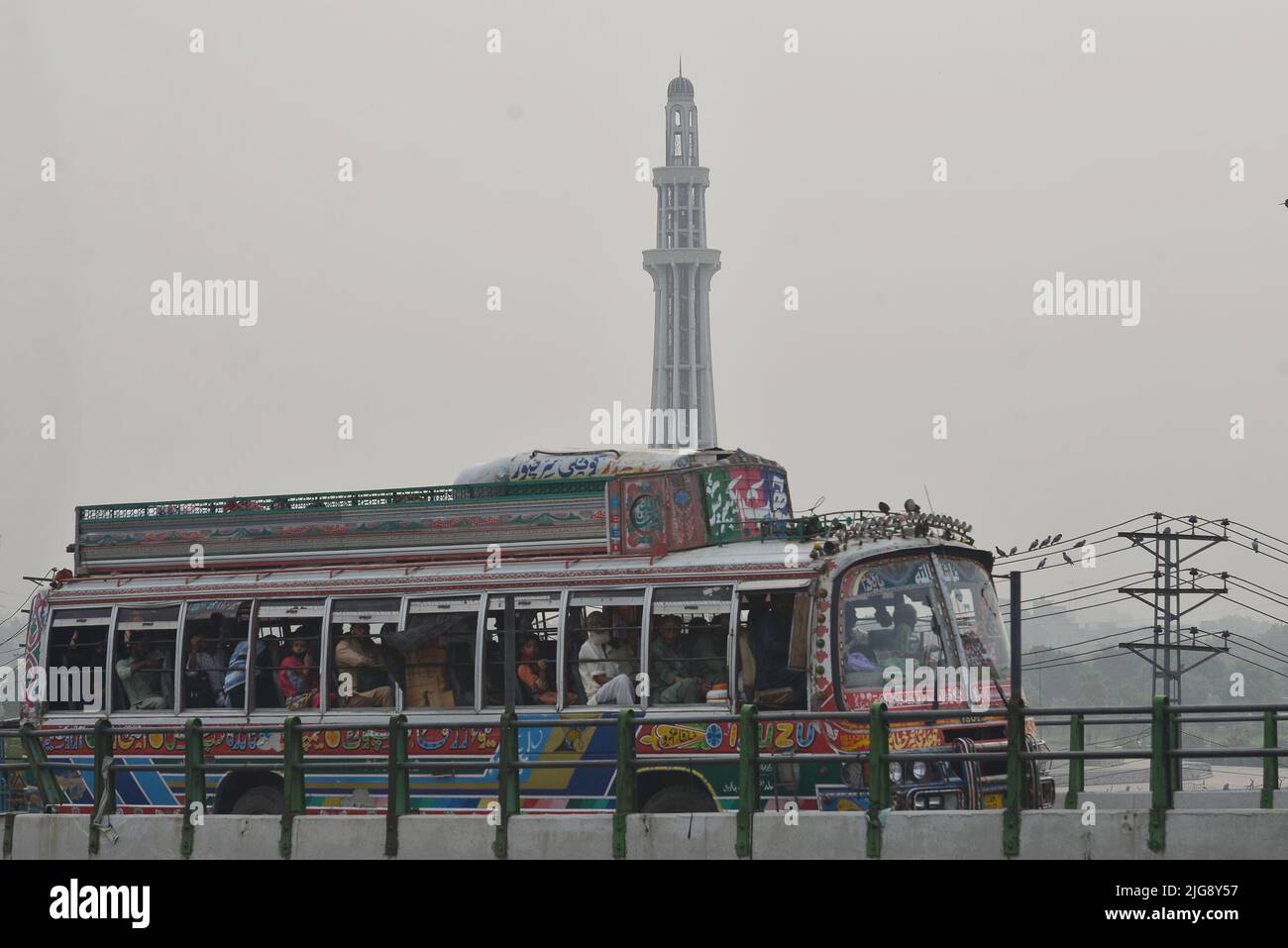 Pakistani people boarding roof top on a crowded bus as they travel to ...