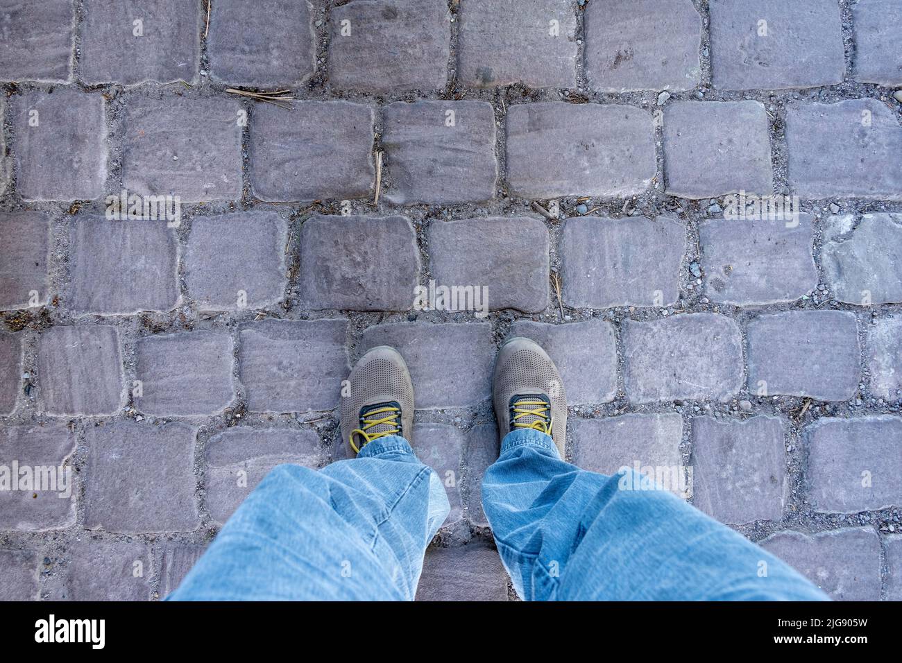 Stand firmly on the ground with both feet on the ground Stock Photo - Alamy