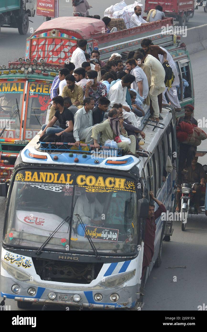 July 8, 2022, Lahore, Punjab, Pakistan: Pakistani people boarding roof ...