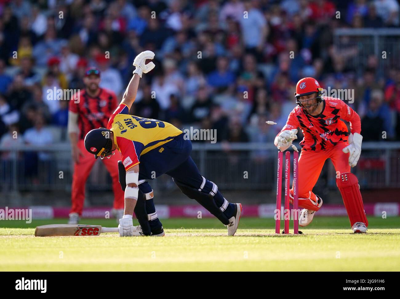 Essex's Daniel Sams (left) survives an attempted stump by Lancashire ...
