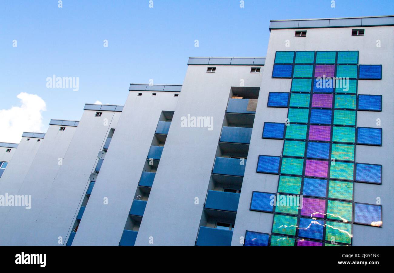 Colorful Photovoltaic Modules On A Facade Of An Apartment Block ...