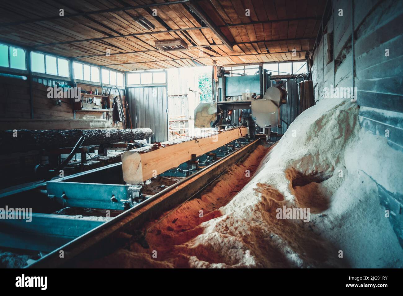 Sawmill. Process of machining logs in equipment sawmill machine saw ...