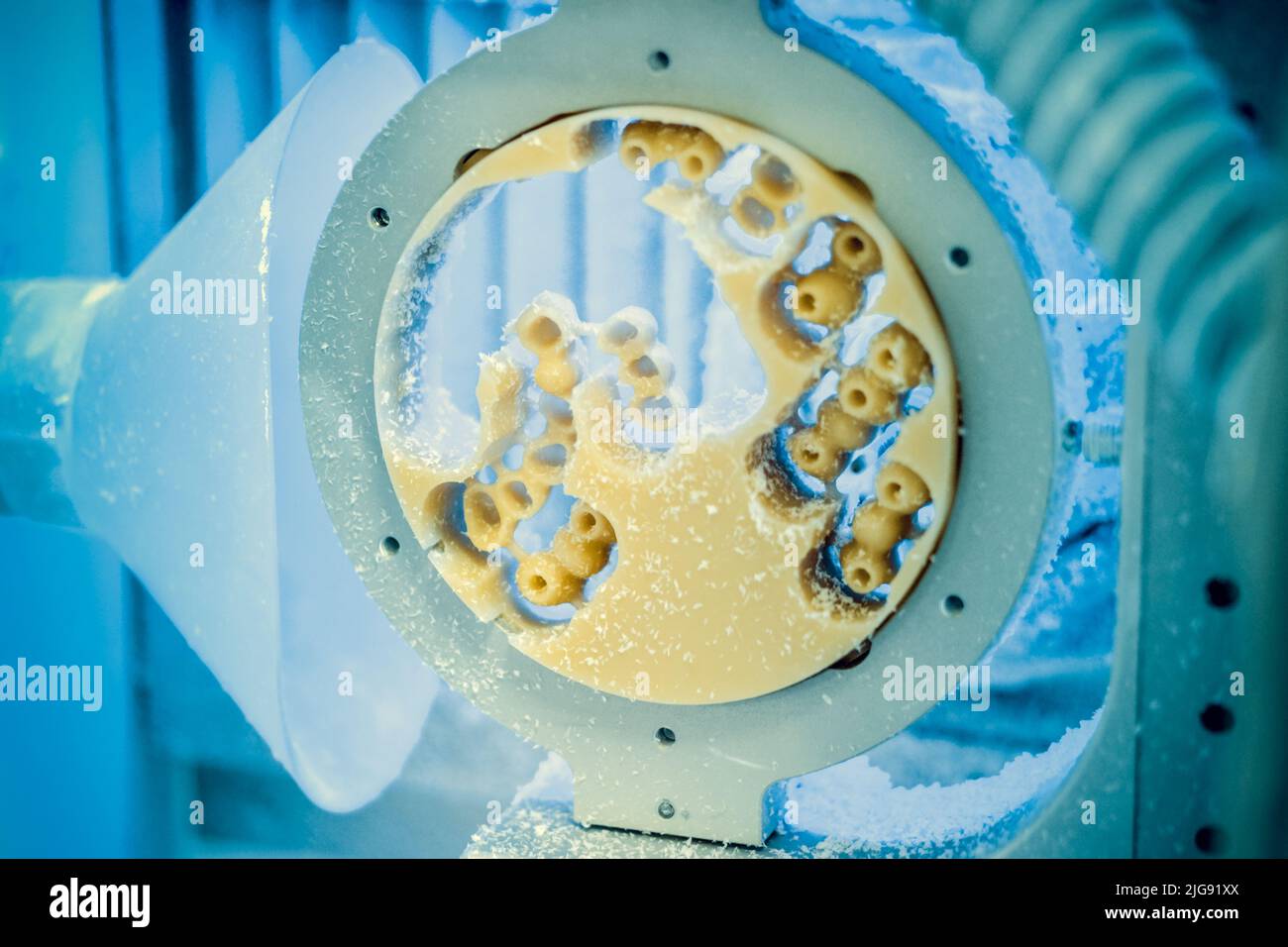 Dental milling machine carving out shape of human teeth close-up ...