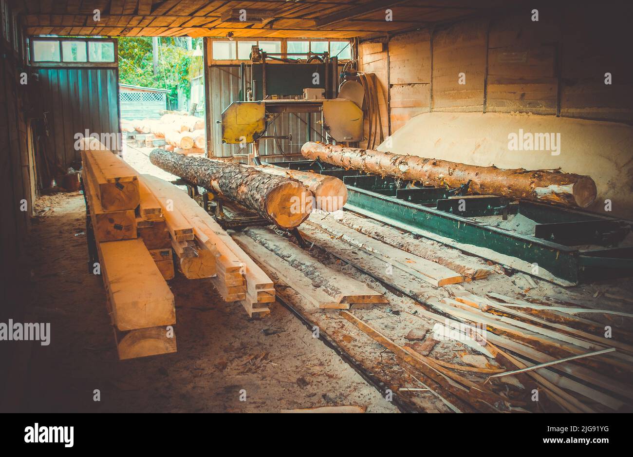 Sawmill. Process of machining logs in equipment sawmill machine saw ...