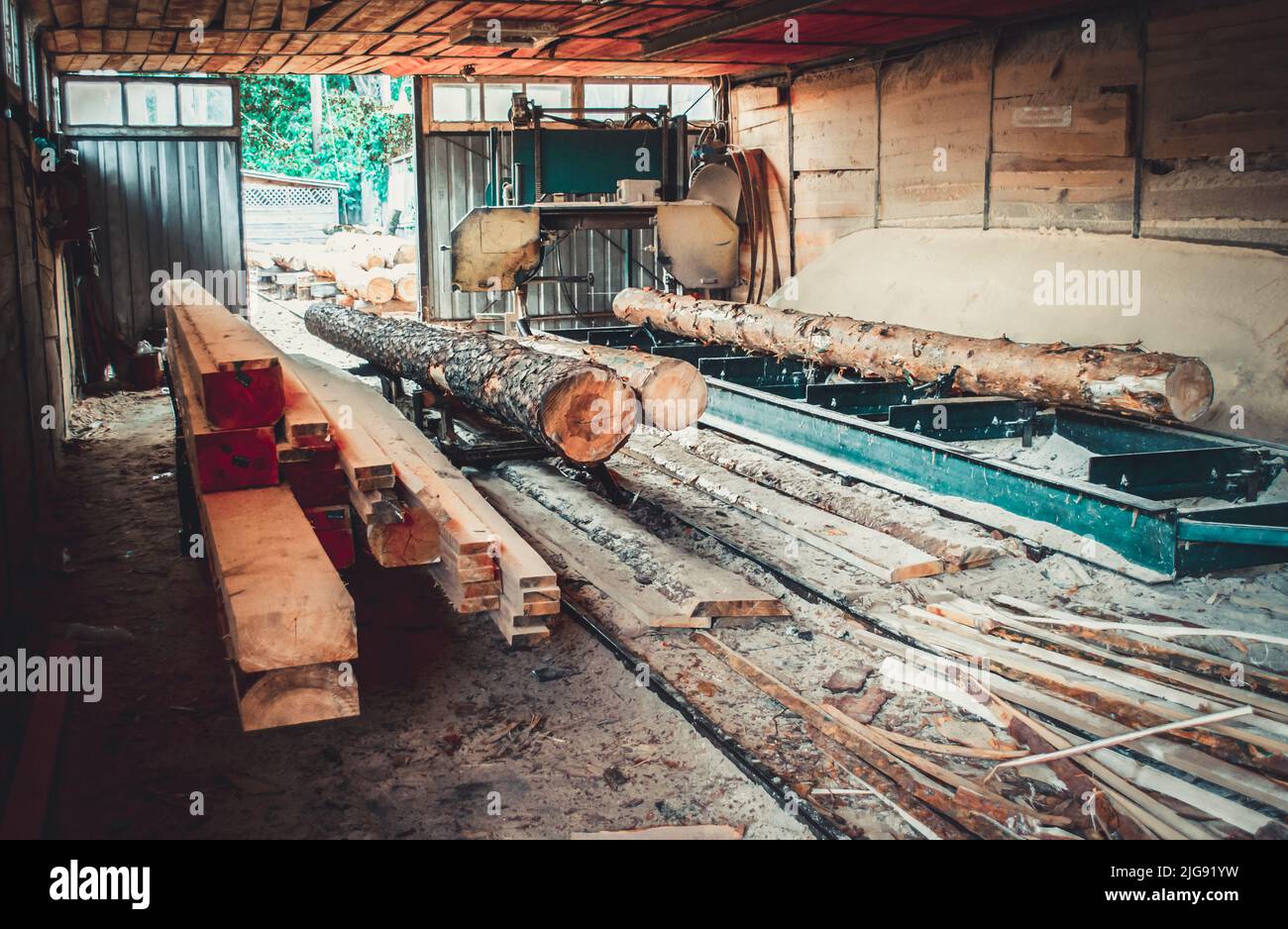 Sawmill. Process of machining logs in equipment sawmill machine saw ...