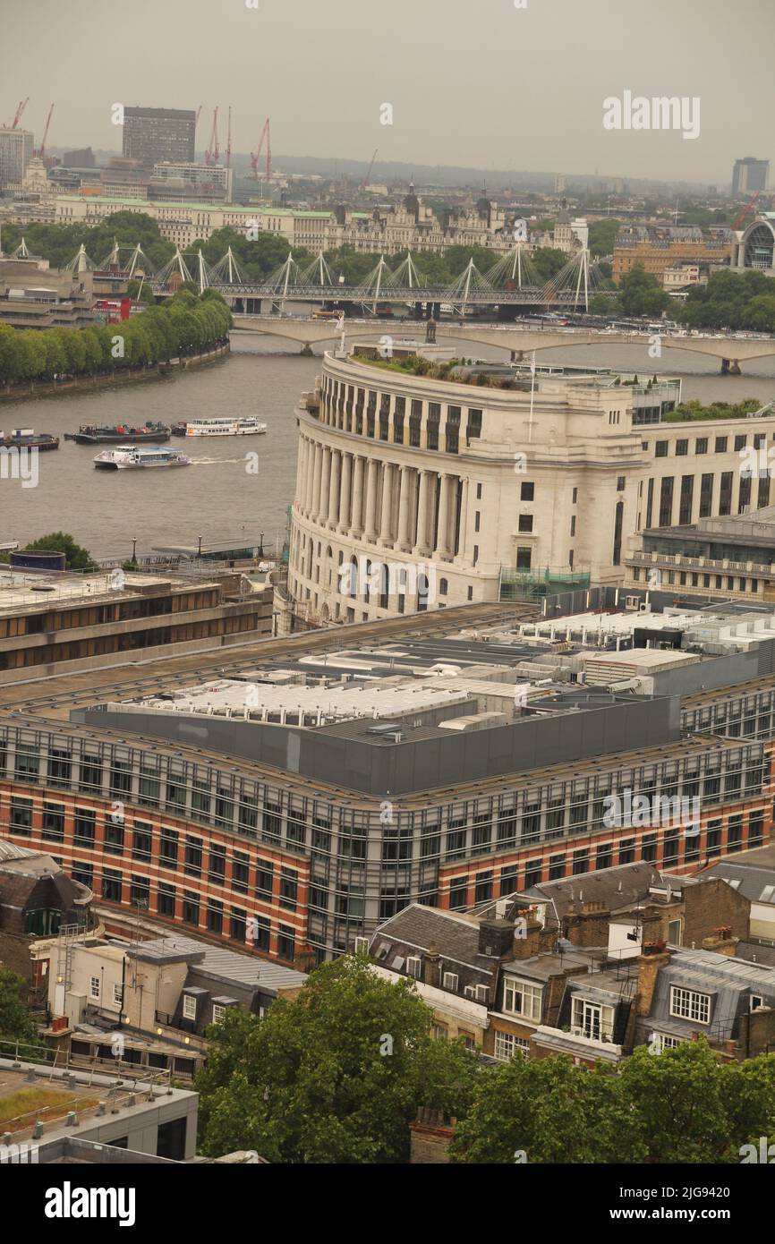 A vertical aerial view of a cityscape with buildings and river in the ...