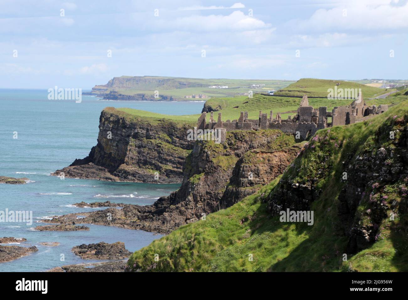 Rugged north coast at Dunluce Castle in Northern Ireland Stock Photo ...