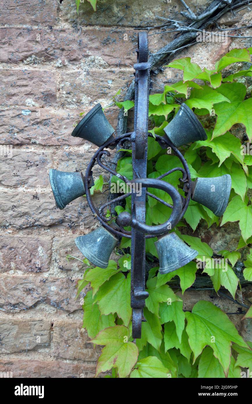rotating house bells on brick wall, The Borgo Tolomei from the 12th ...