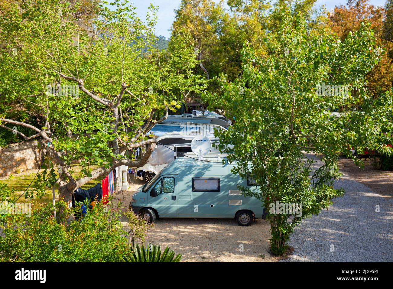Motorhomes under trees on campsite on the island of elba hi-res stock ...