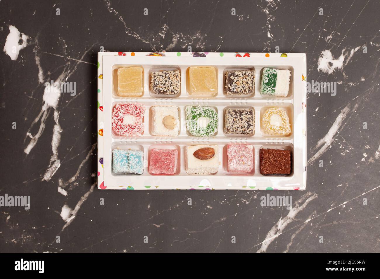 Cubes of traditional oriental sweets on a marble background, top view ...