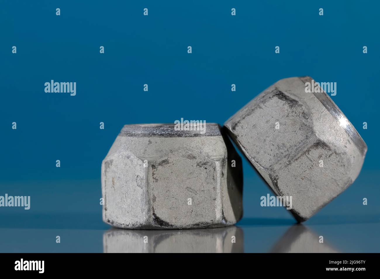 These are wheel rim nuts. These small items are automotive parts and ...