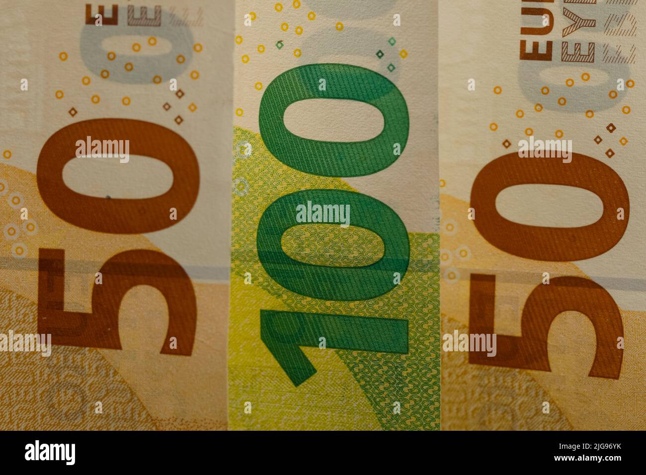 Euro banknotes form the background. The currency of the euro area have ...