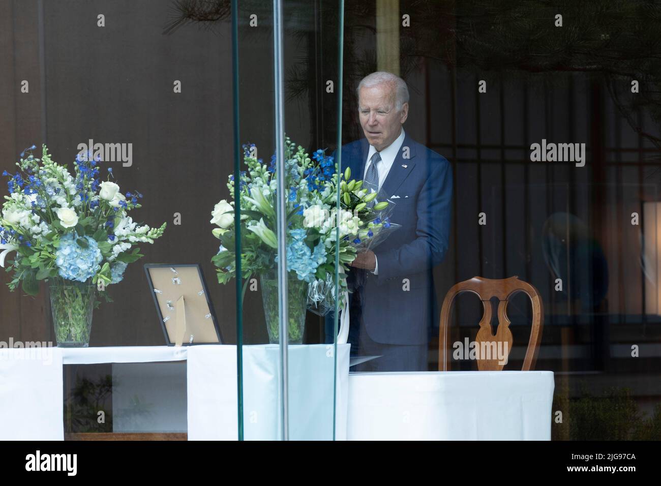 United States President Joe Biden signs a condolence book in honor of ...