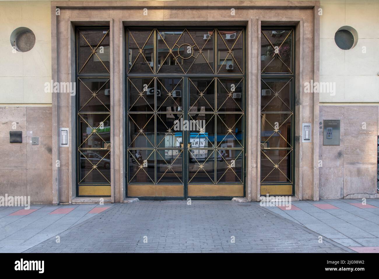 Facade of buildings with an entrance portal with a representative glass ...