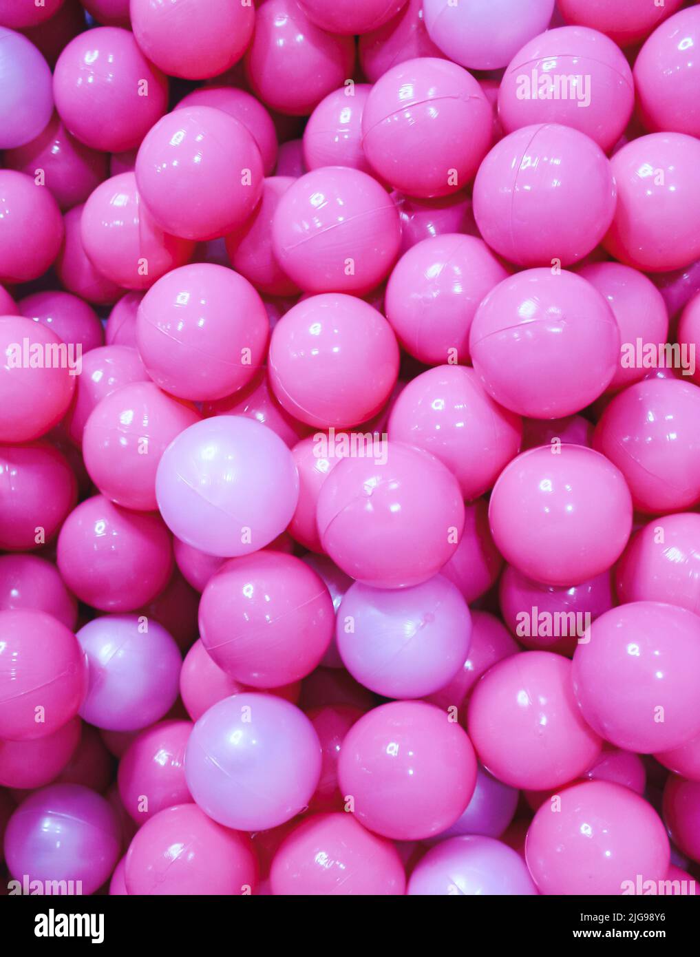 Pink plastic balloons. Isolated pink color background. Monochromatic ...