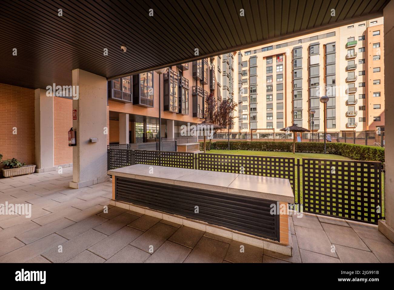 Facades of urban residential buildings with interior common areas with ...