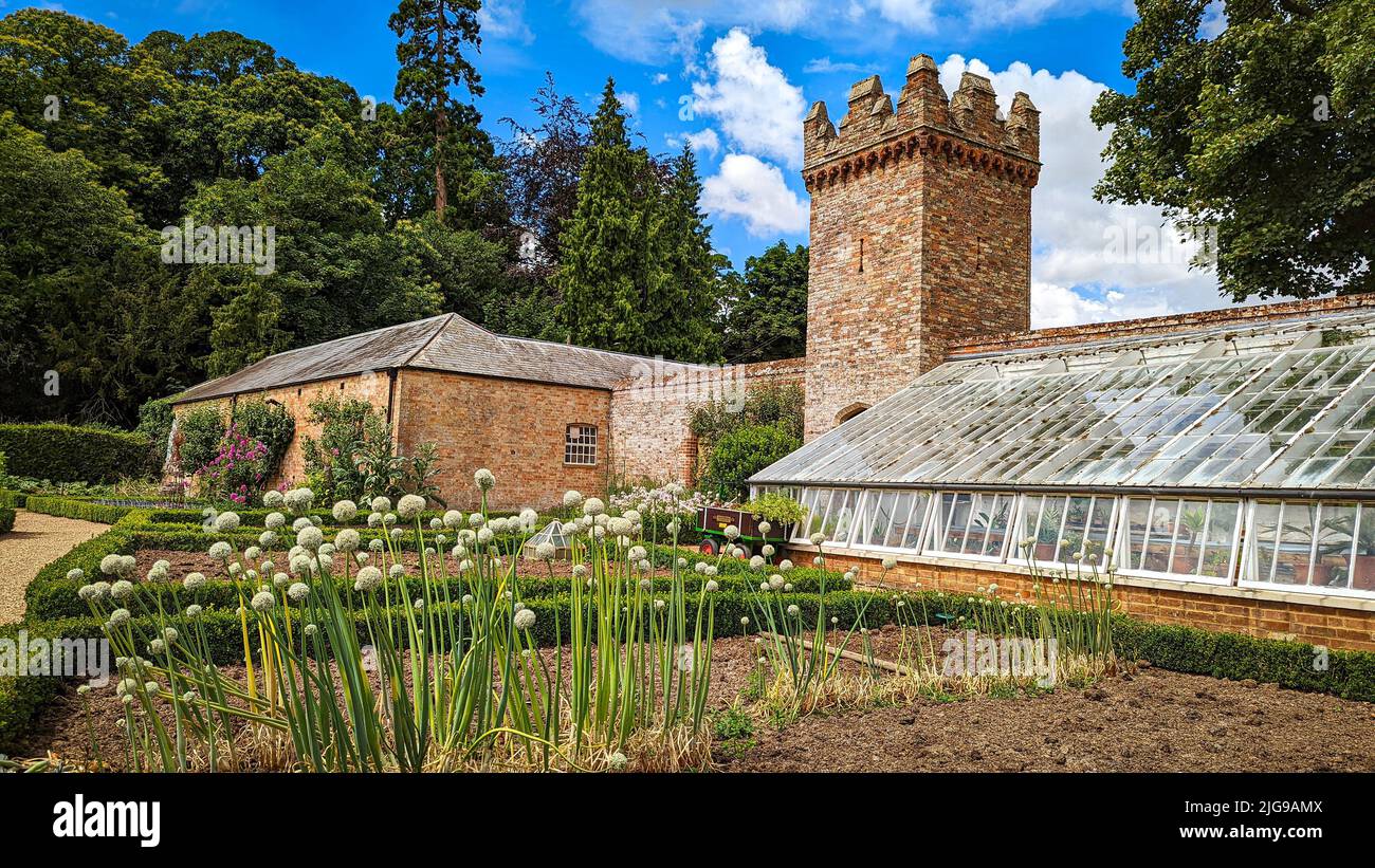 The Oxburgh Hall moated country house with a lawn in Oxborough, Norfolk ...
