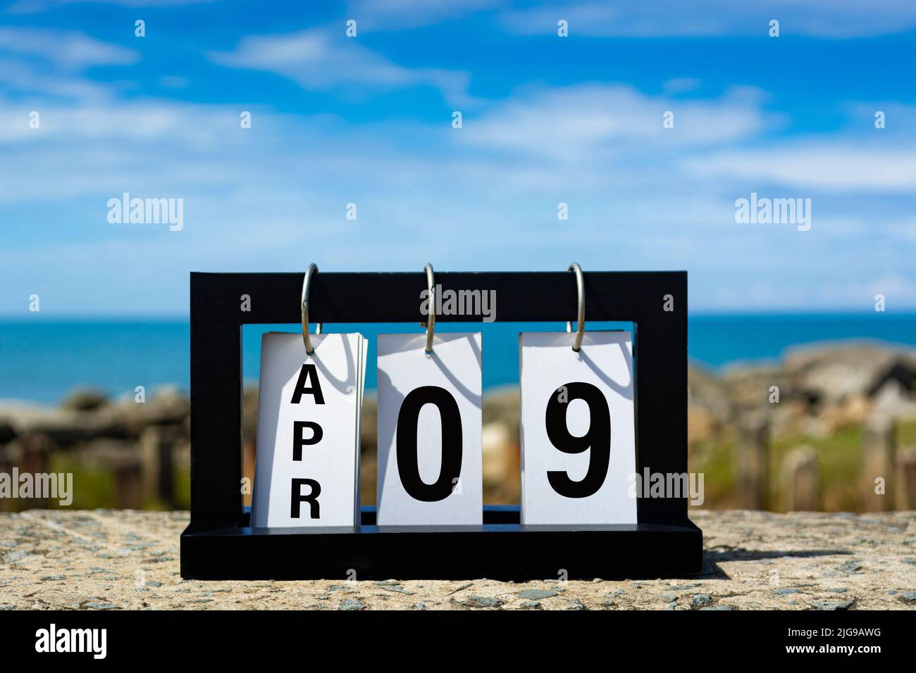 Apr 09 calendar date text on wooden frame with blurred background of ...