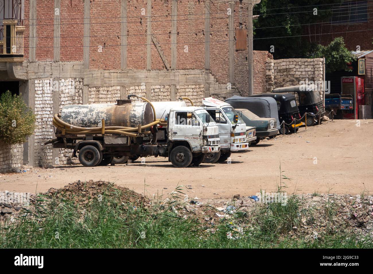 Vehicles parked on a street in Egypt Stock Photo - Alamy