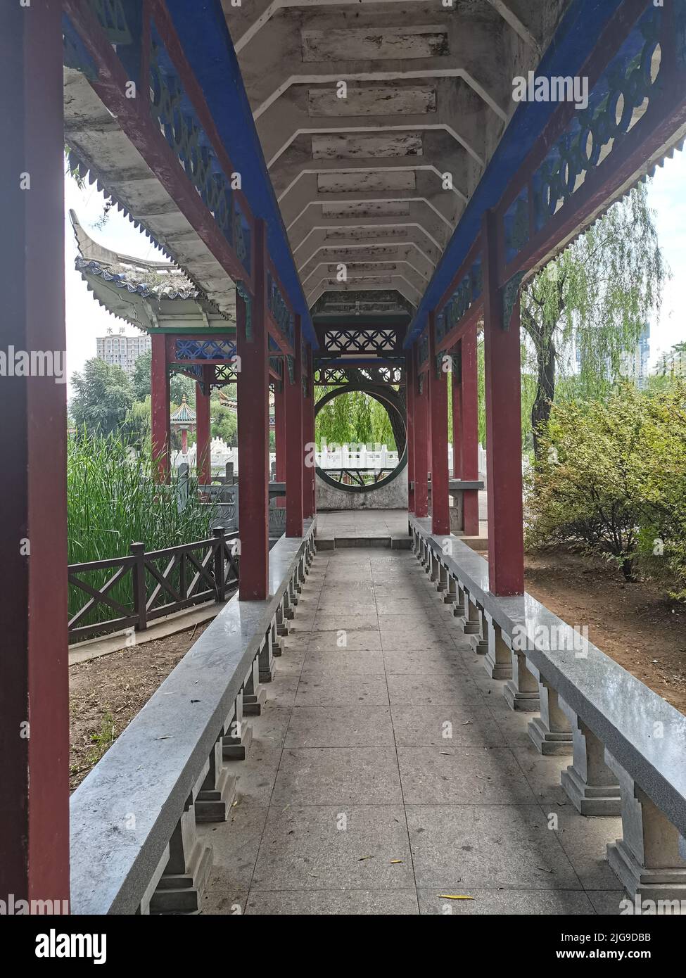 The vertical view of the ancient Chinese long corridor Stock Photo - Alamy