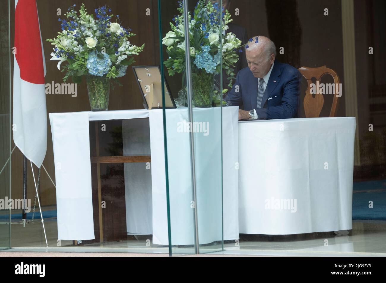 United States President Joe Biden signs a condolence book in honor of ...