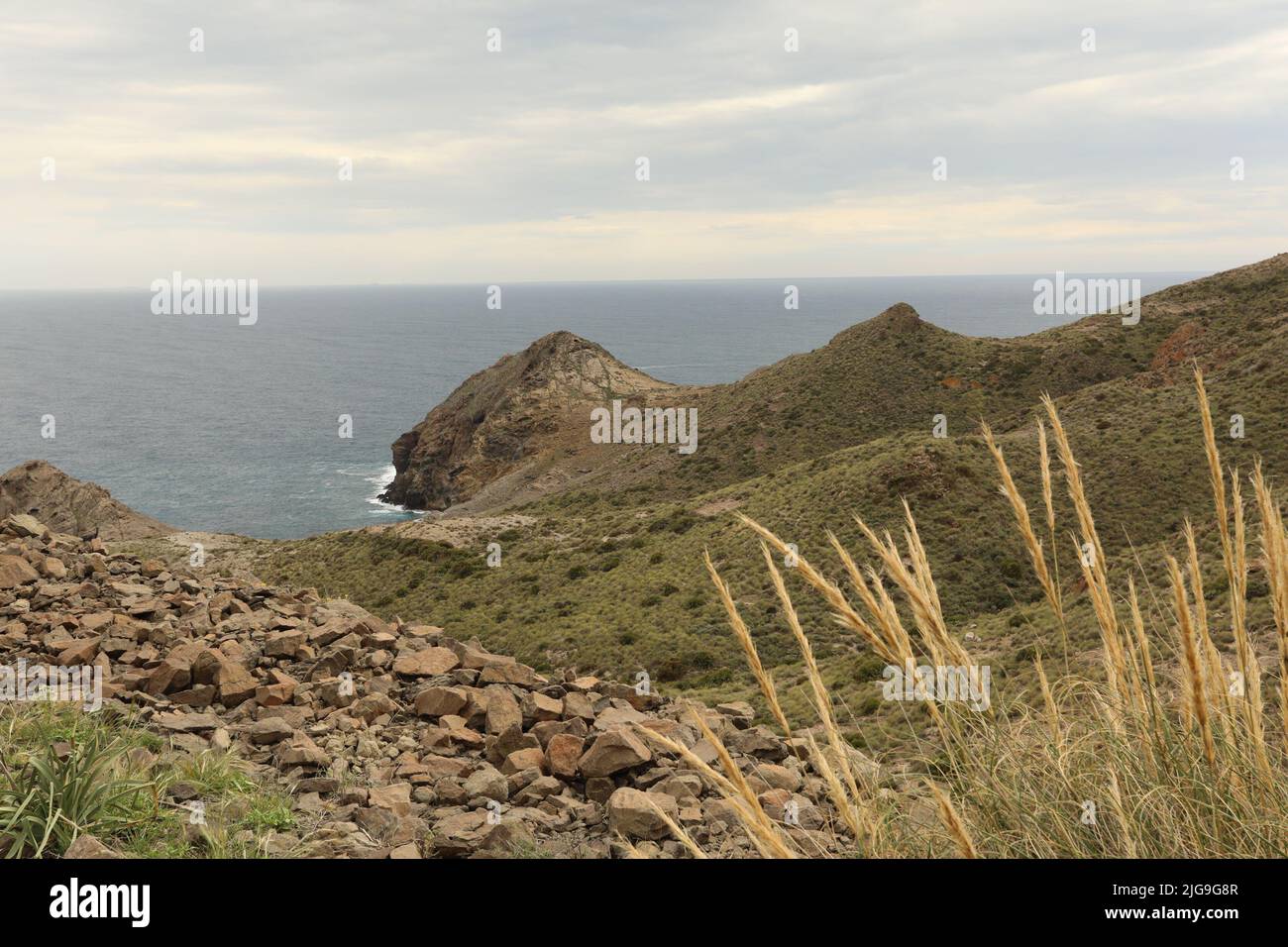 Hidden beach by the ocean sea with natural caves, sand and cliff Stock ...