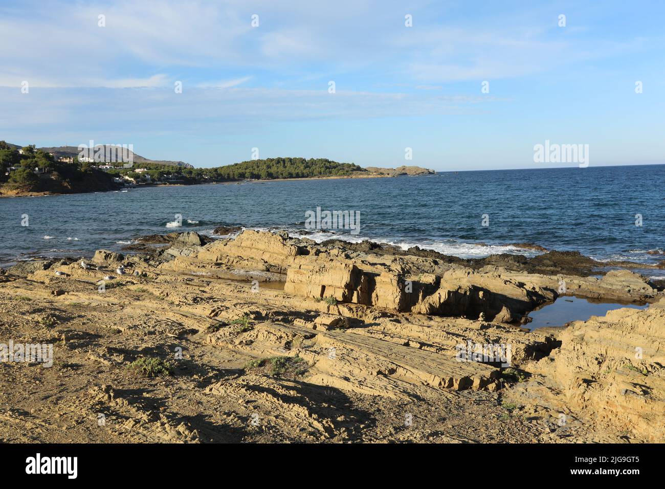 Hidden beach by the ocean sea with natural caves, sand and cliff Stock ...