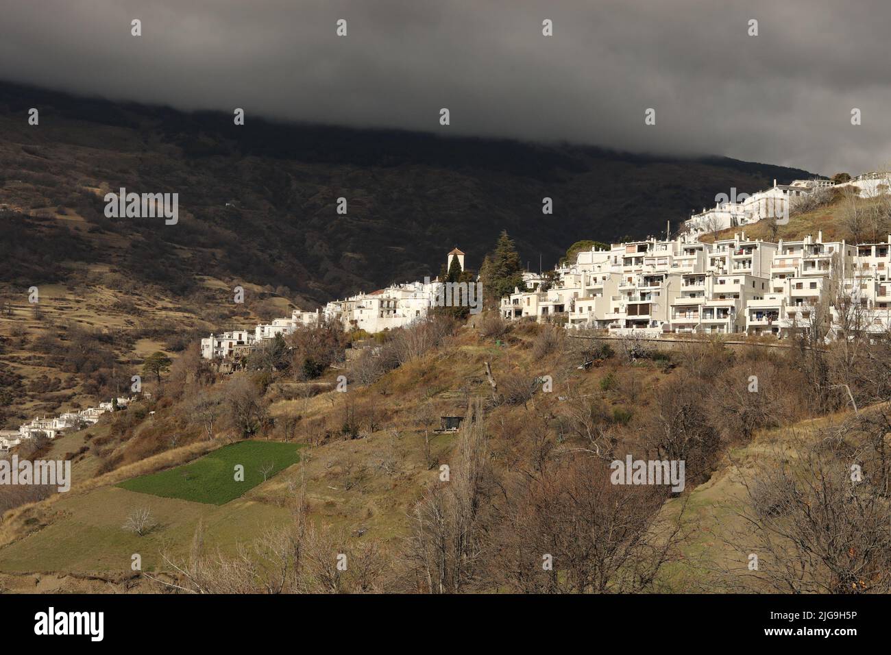 Capileira Village with white houses in the mountains of Alpujarras ...