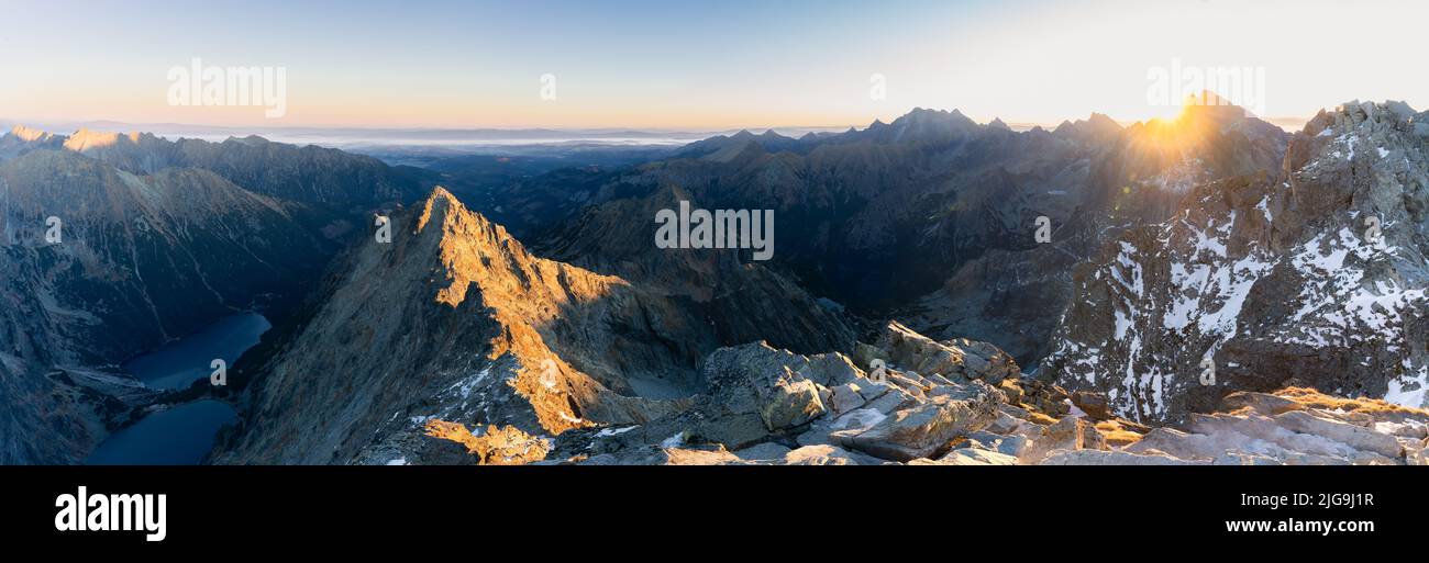 Panoramic view on alpine landscape with tarns and rocky mountain peaks ...