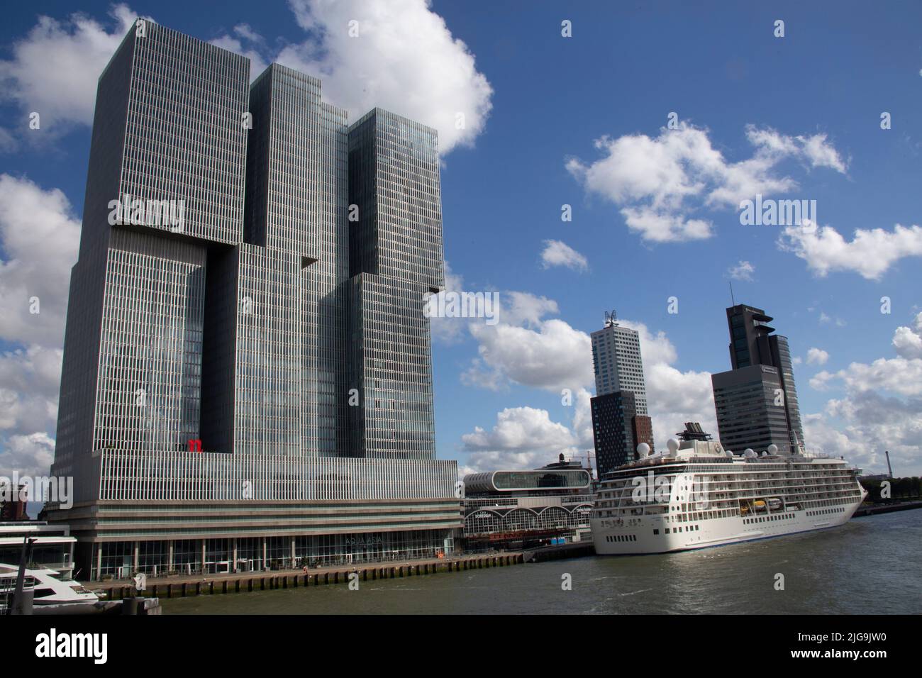 A cruise liner docked at Rotterdam's waterfront on the Nieuwe Maas ...
