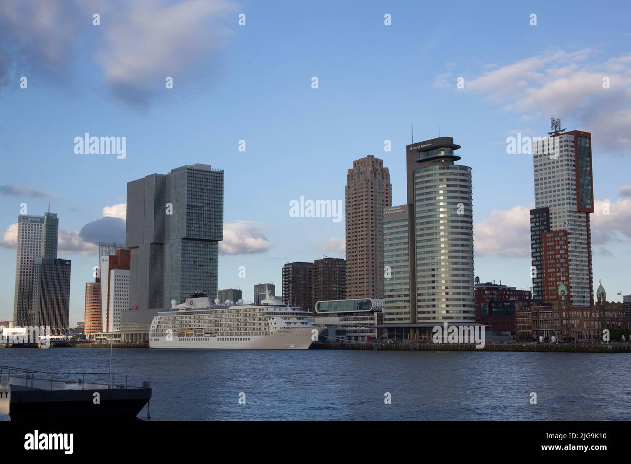 A cruise liner docked at Rotterdam's waterfront on the Nieuwe Maas ...