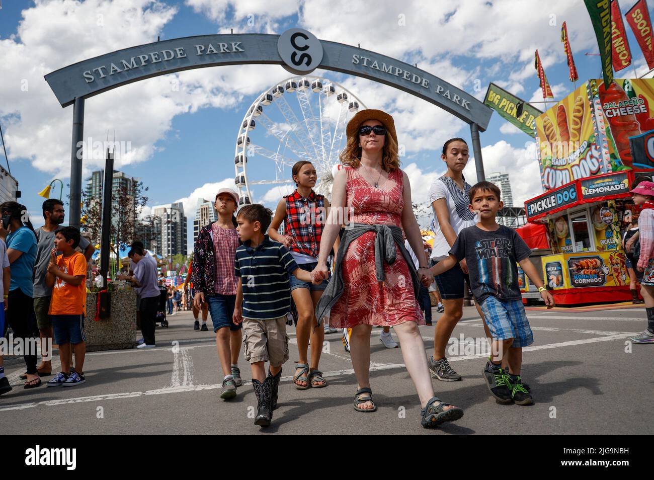 July 8, 2022, Calgary, AB, CANADA: Visitors take in the midway at the ...