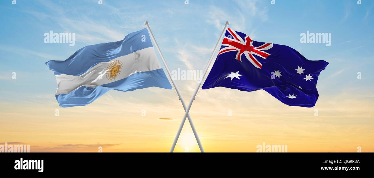 crossed national flags of Argentine and Australia flag waving in wind ...