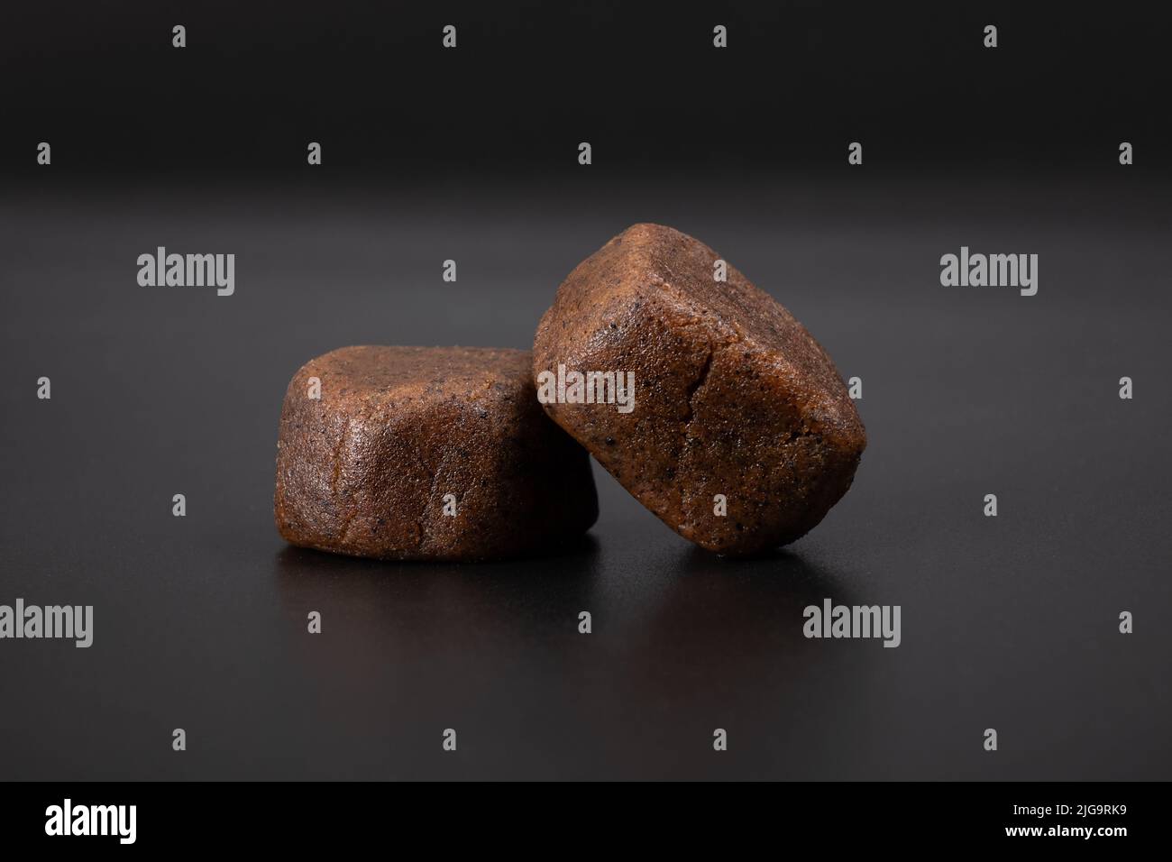 dark lumps of cannabis Moroccan hashish with high thc on a black ...