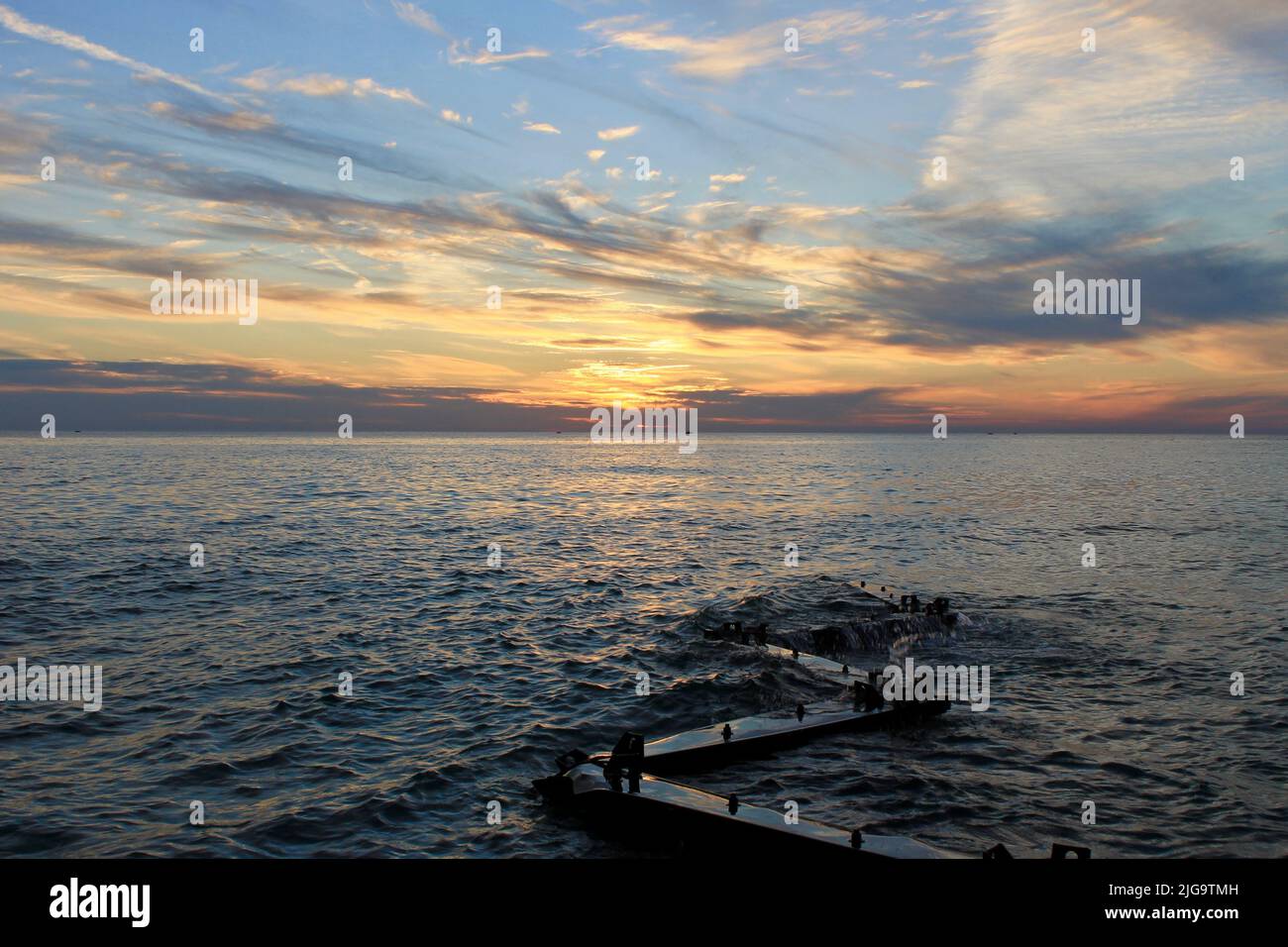 The Dock at Sunset Stock Photo - Alamy
