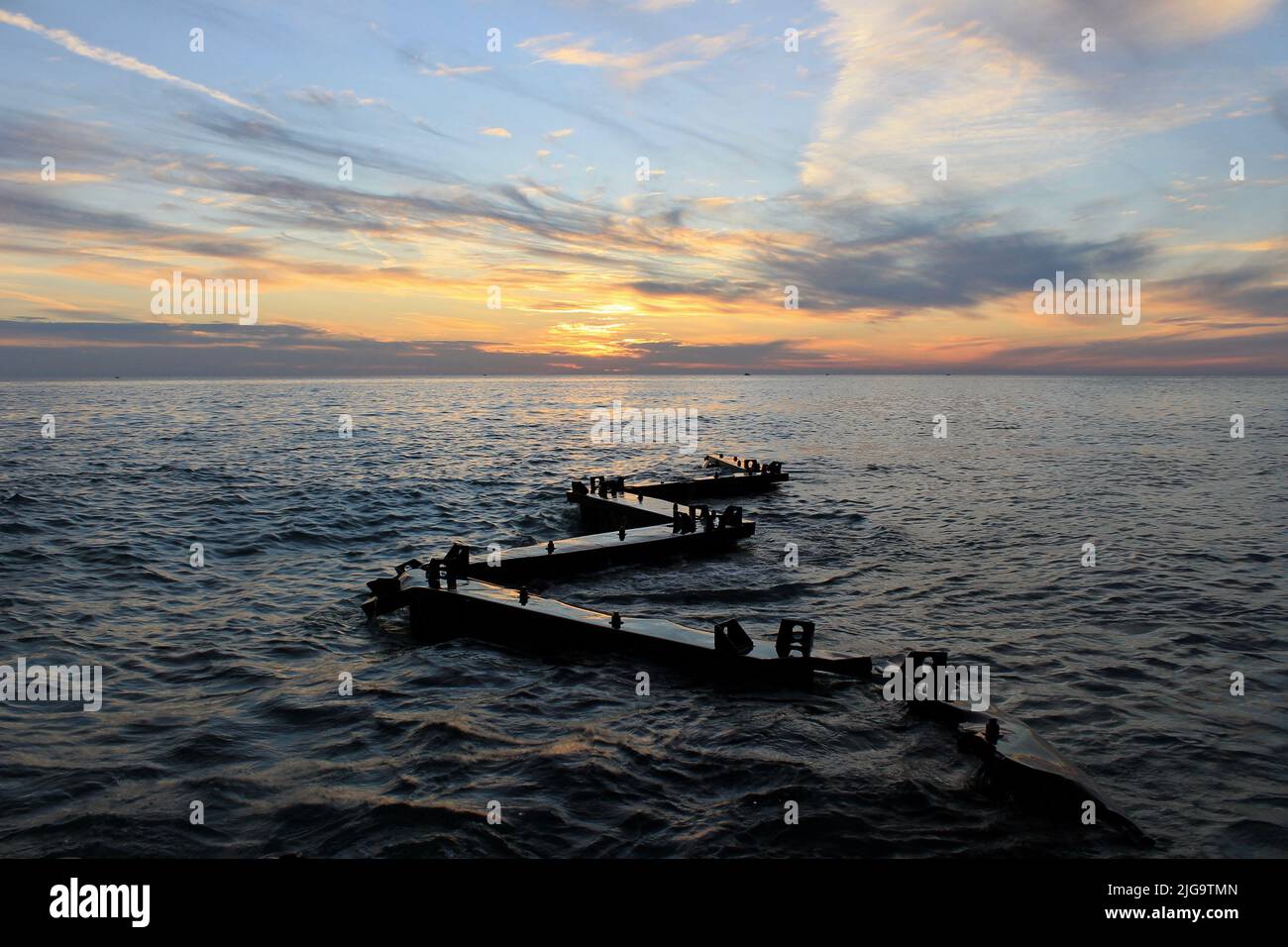 The Dock at Sunset Stock Photo - Alamy